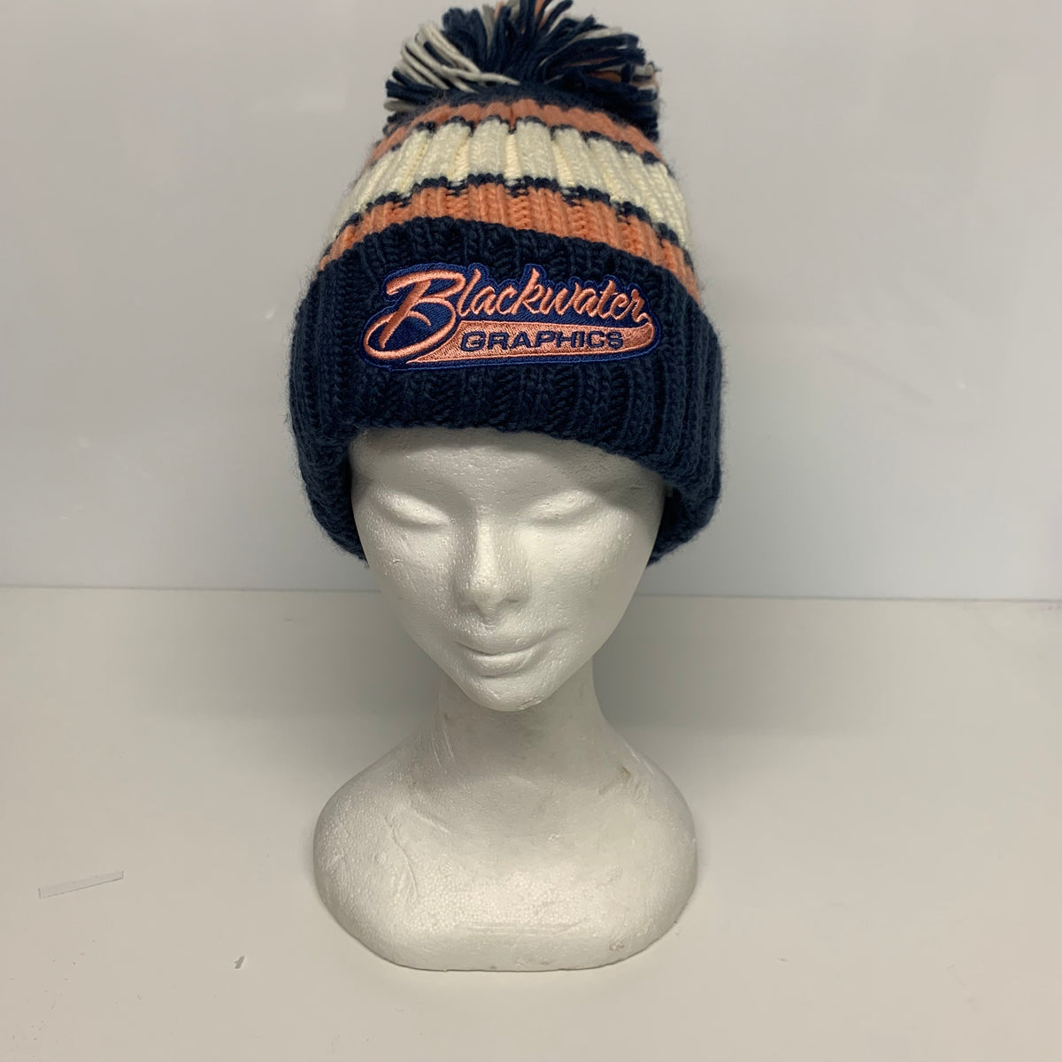 Navy and Peach Bobble Hat – Blackwater Graphics